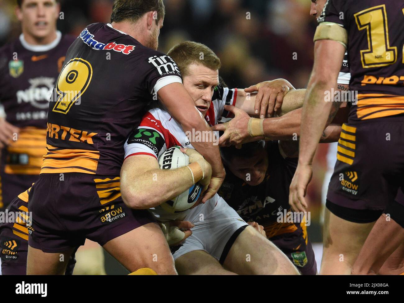 Ben Creagh of the St George Illawarra Dragons is tackled during their ...