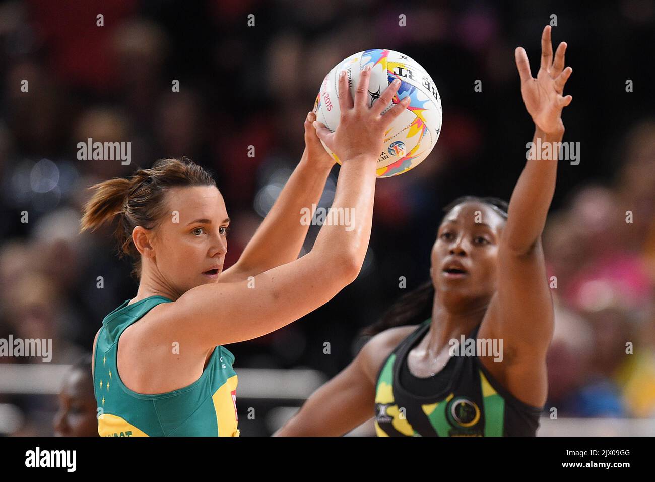 Natalie Medhurst of Australia looks to pass the ball despite pressure ...