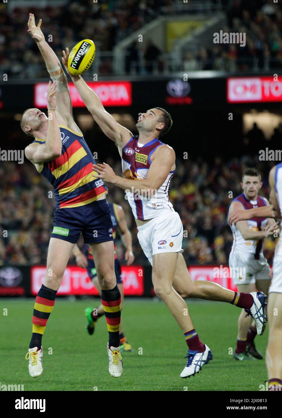 Sam Jacobs of the Crows contests for ball against Trent West of the ...