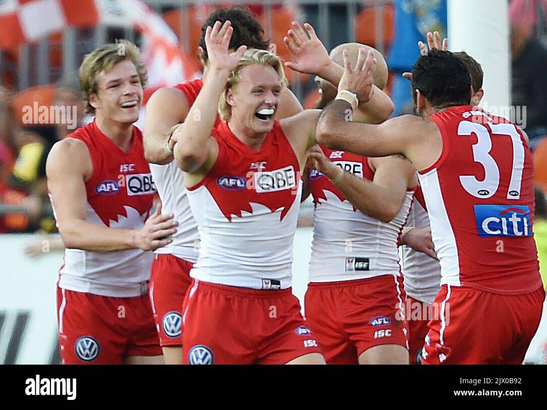 James Rose of the Swans celebrates another goal with team mate Adam ...