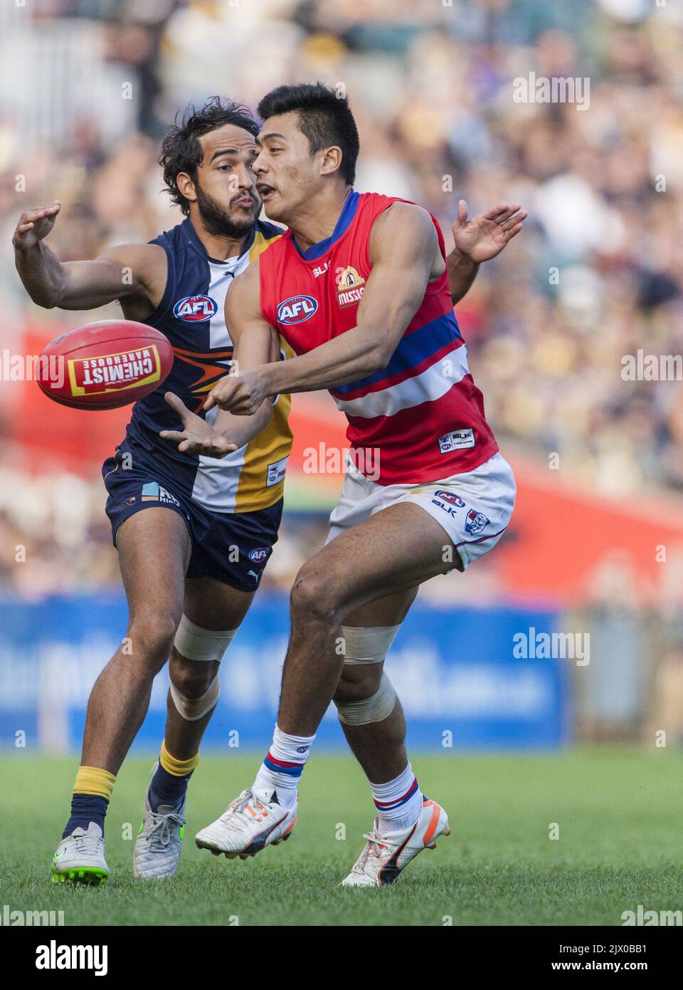 Jamie Bennell of the West Coast Eagles and Lin Jong of the Western ...