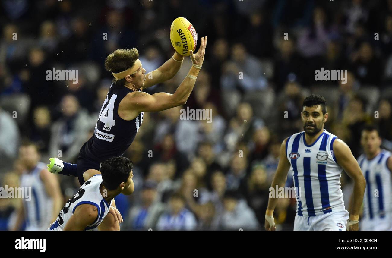Fremantle Dockers player Lee Spurr marks over North Melbourne Kangaroos ...