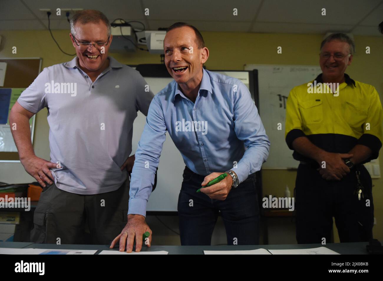 Prime Minister Tony Abbott uses a 3D printed pen during a visit to the ...