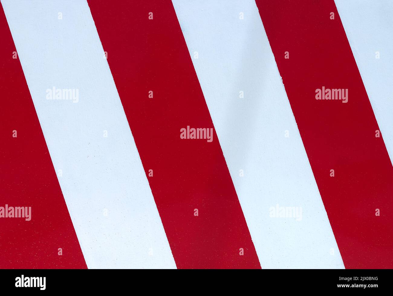 detail of red and white slanted lines indicating no parking of vehicles ...