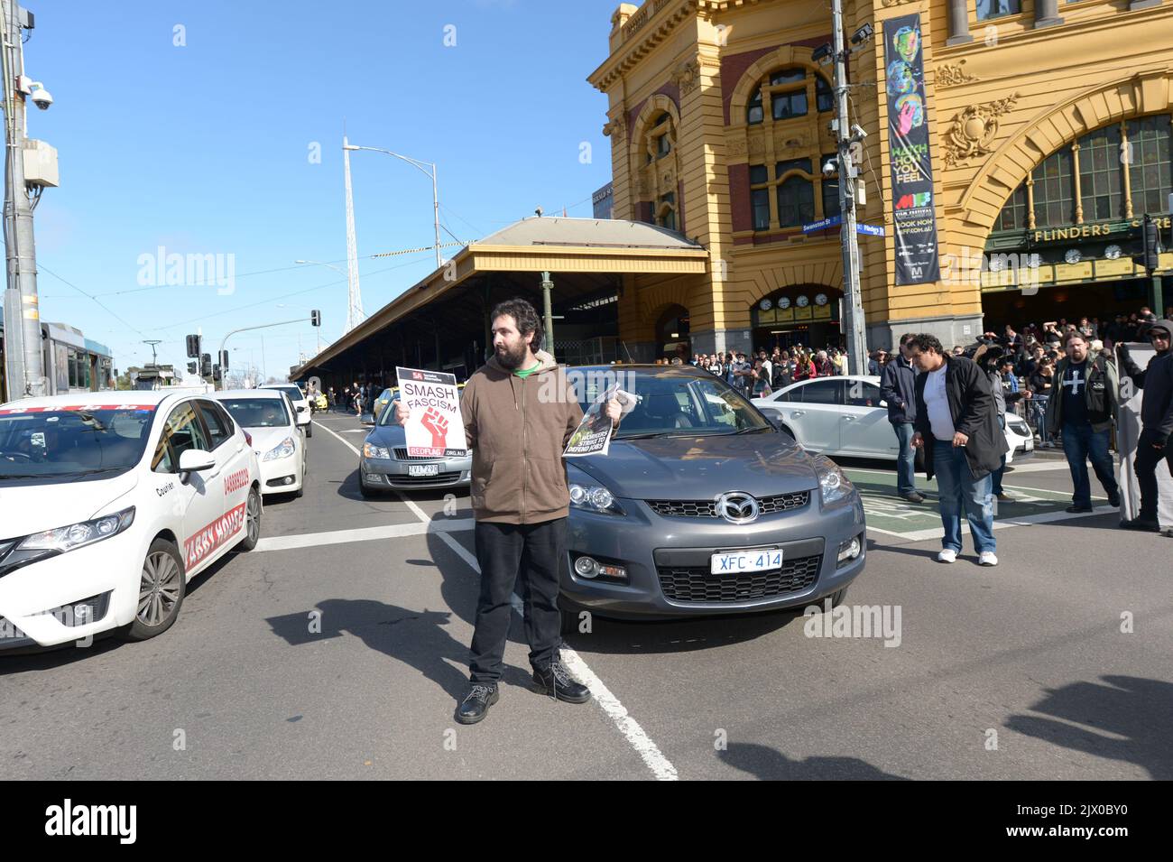Protesters rally and block traffic outside Flinders Street Station ...
