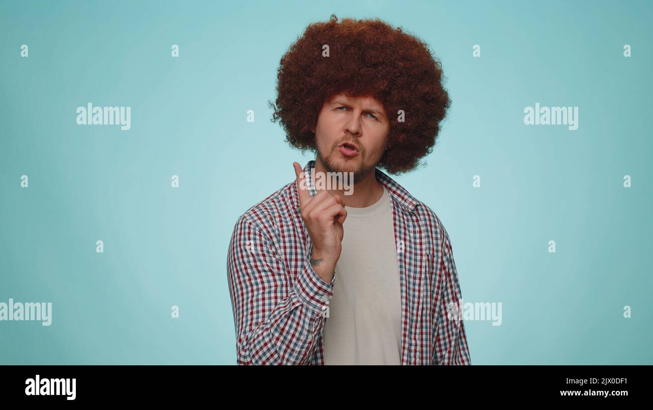 Displeased man shakes finger and saying no, be careful, scolding and ...