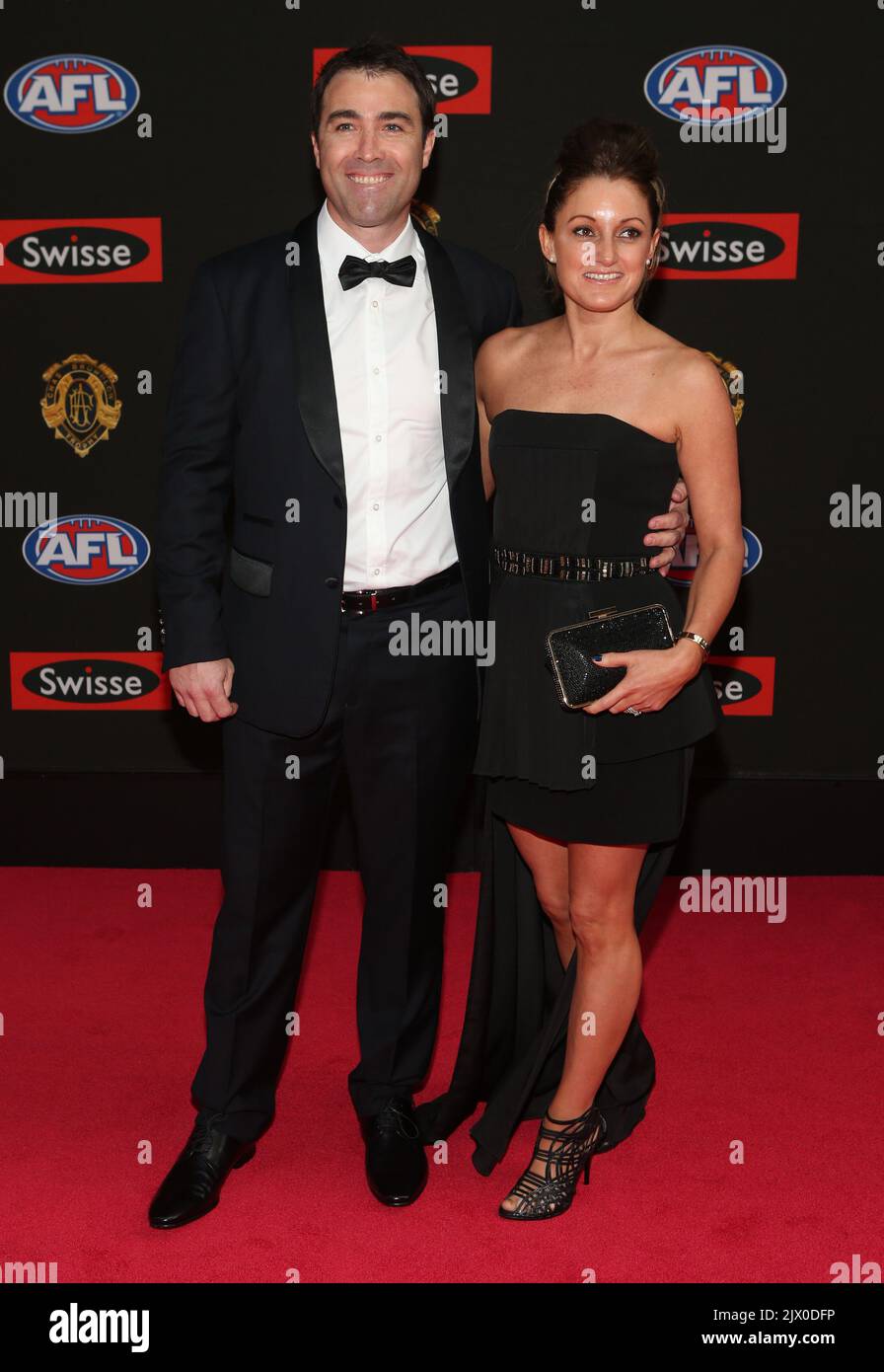 North Melbourne coach (left) Brad Scott and his wife Penny arrive at ...