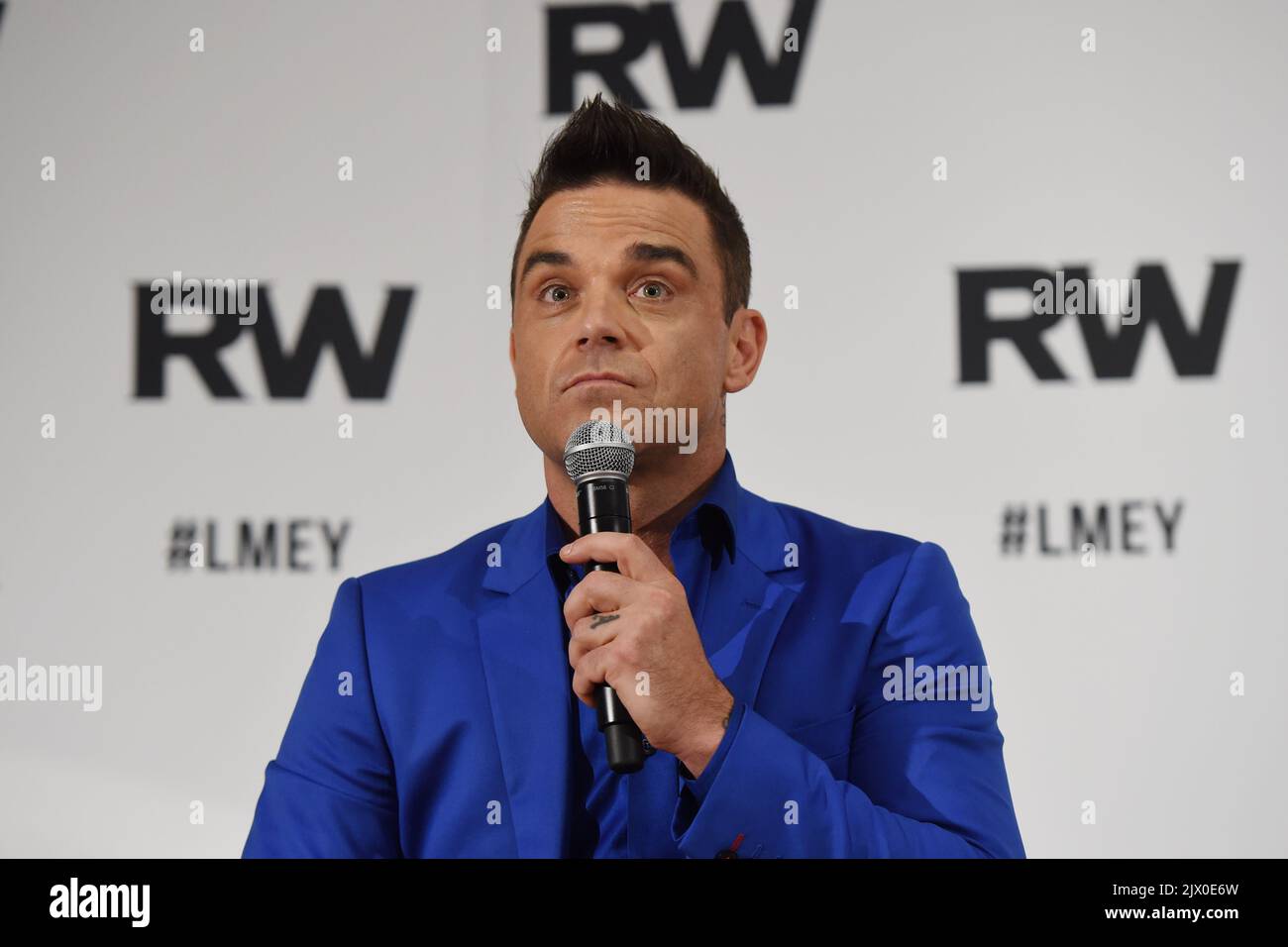 Performer Robbie Williams speaks to the media during a press conference ...