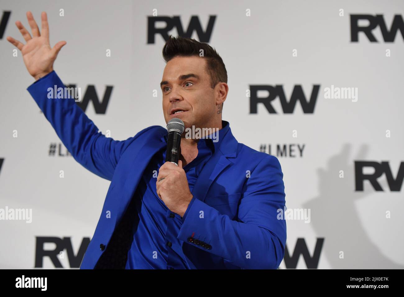 Performer Robbie Williams speaks to the media during a press conference ...