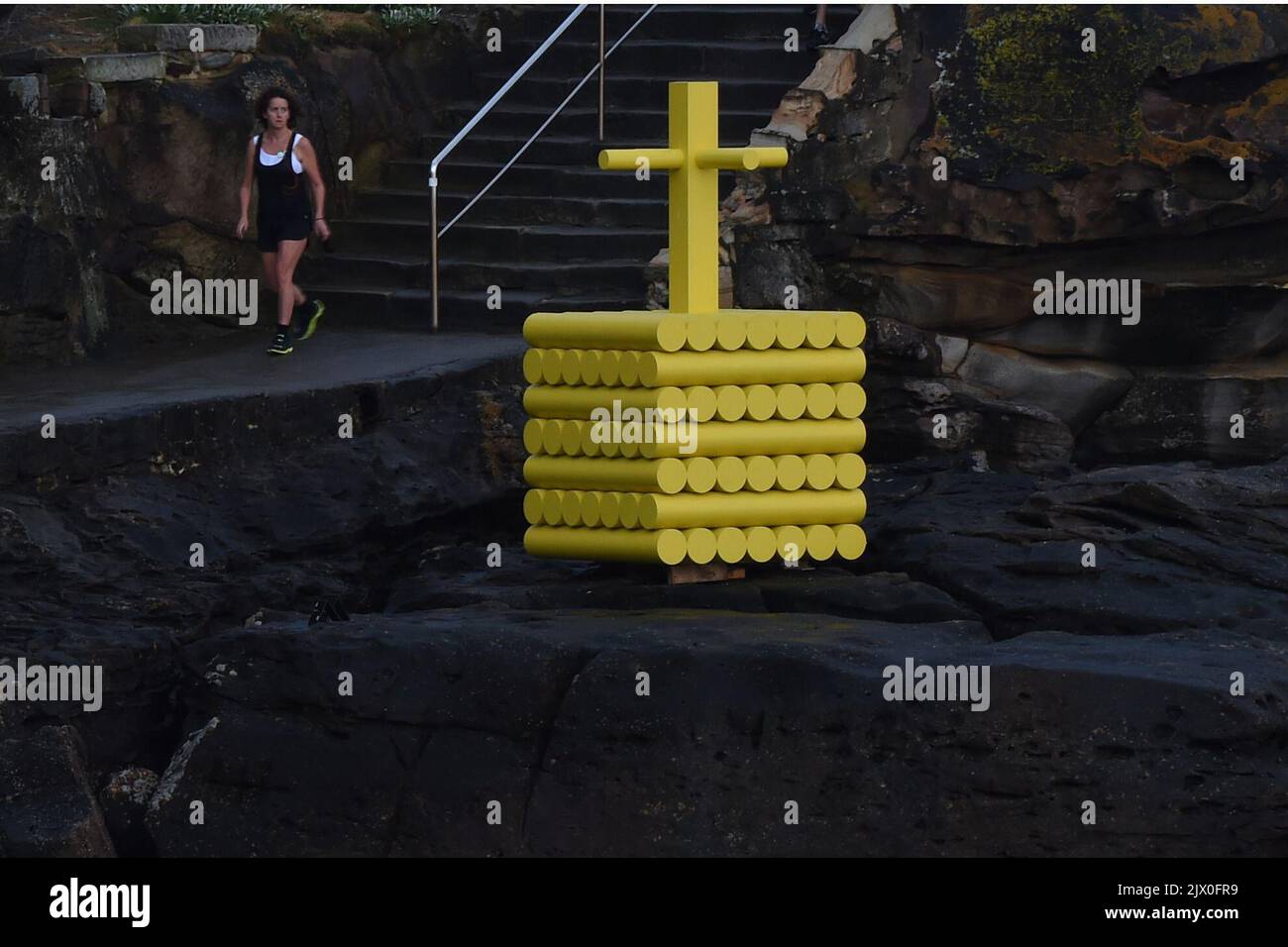 A jogger passes by a sculpture during the annual Sculpture by the Sea ...