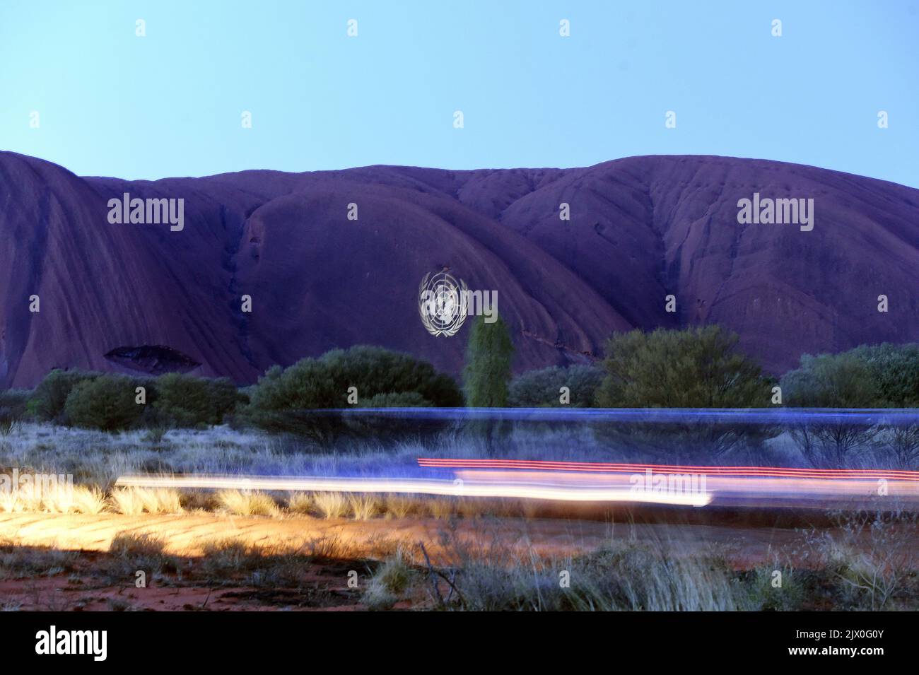 The United Nations' crest is projected onto Australia's iconic red rock ...