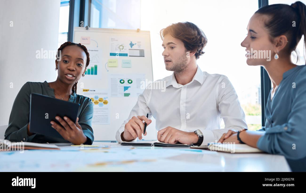 Business team, analytics and collaboration meeting with tablet for ...