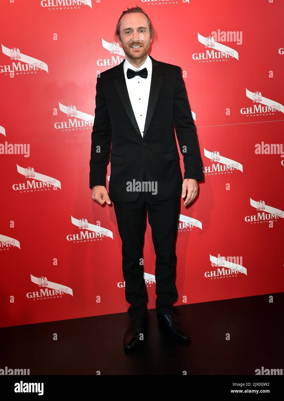 French DJ David Guetta poses for photos in the Mumm marquee in the ...
