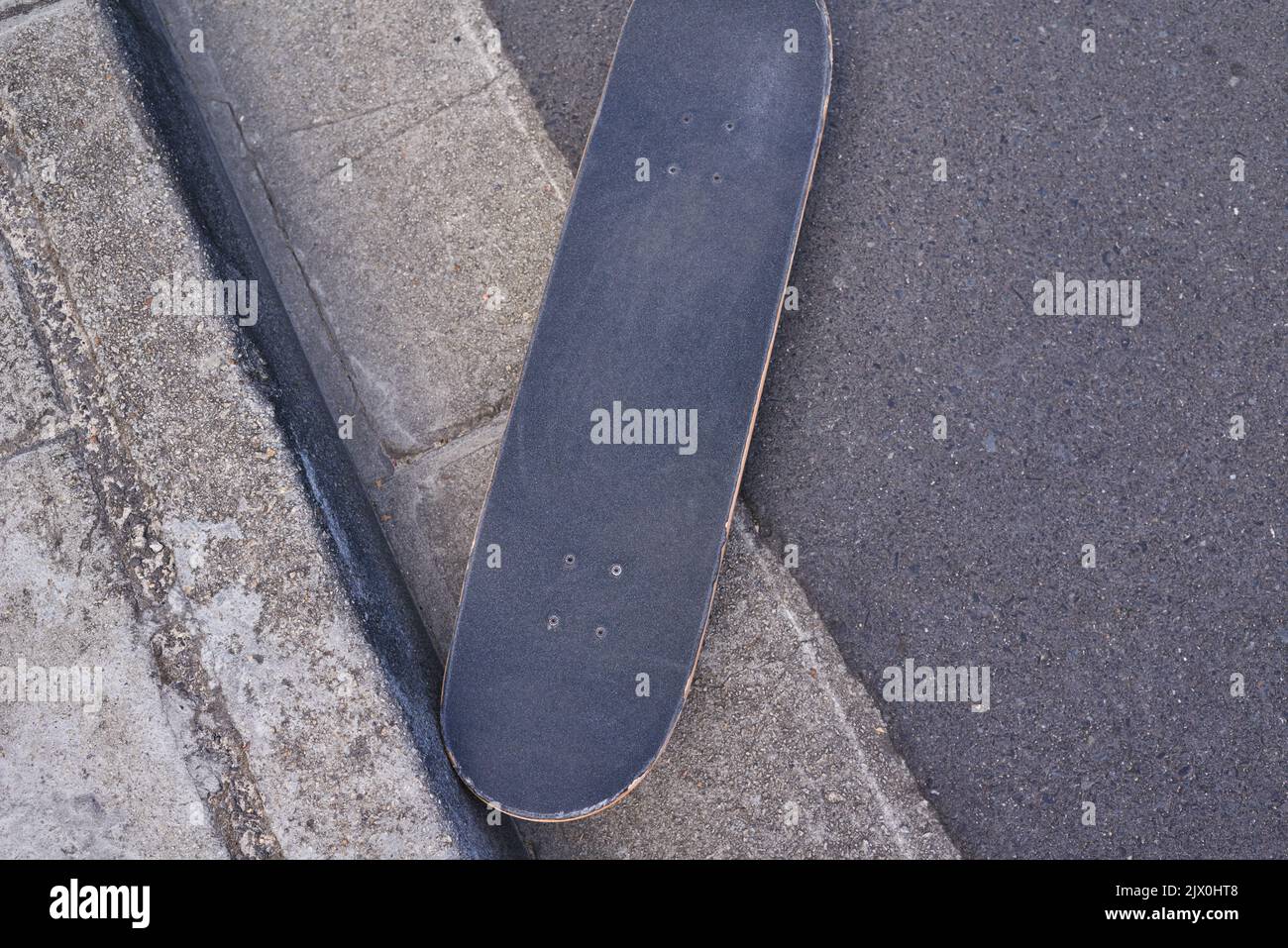 Urban skater. a young man skateboarding through the city Stock Photo ...