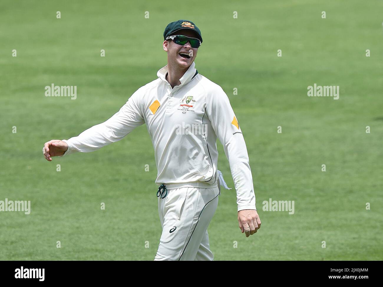 Australian captain Steve Smith smiles in the field before defeating New ...