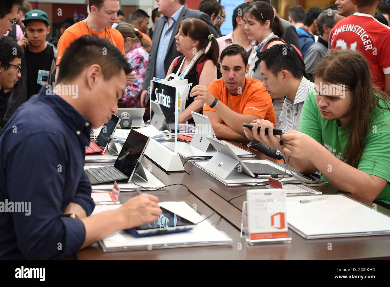 Customers are seen attending the grand opening of the Microsoft ...