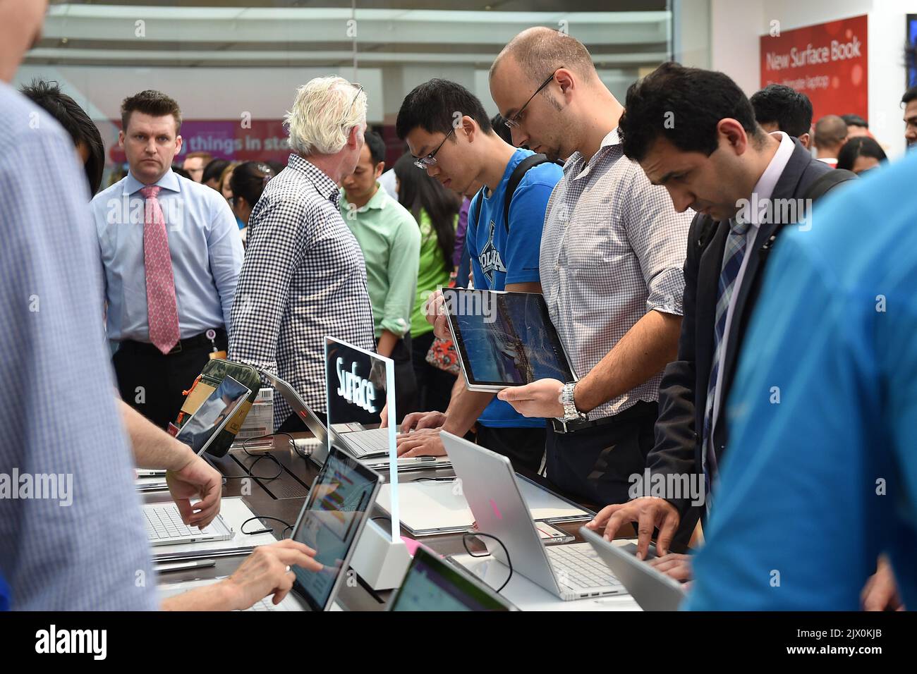 Customers are seen attending the grand opening of the Microsoft ...