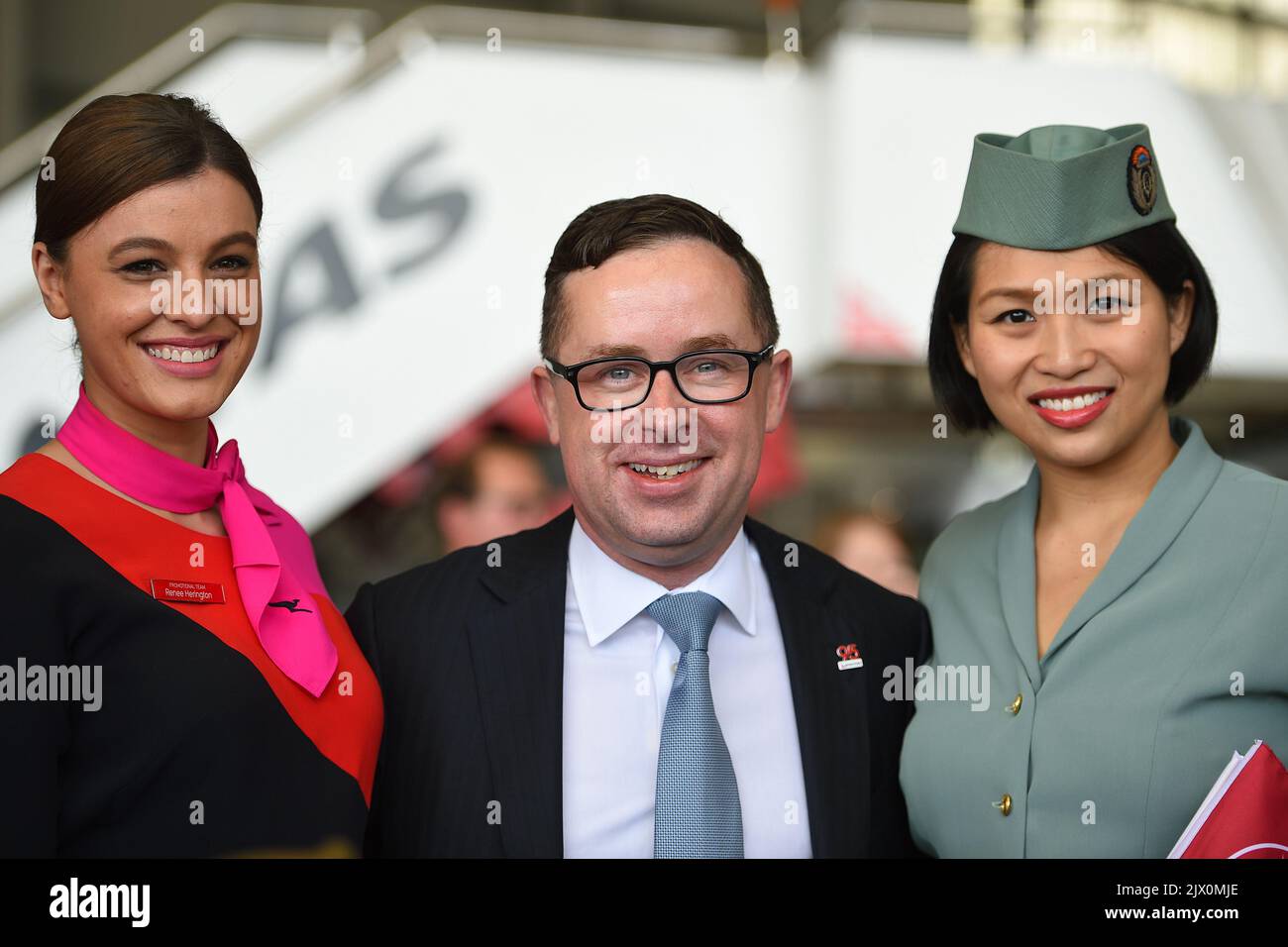 Qantas CEO Alan Joyce poses for photographs with flight attendants at ...