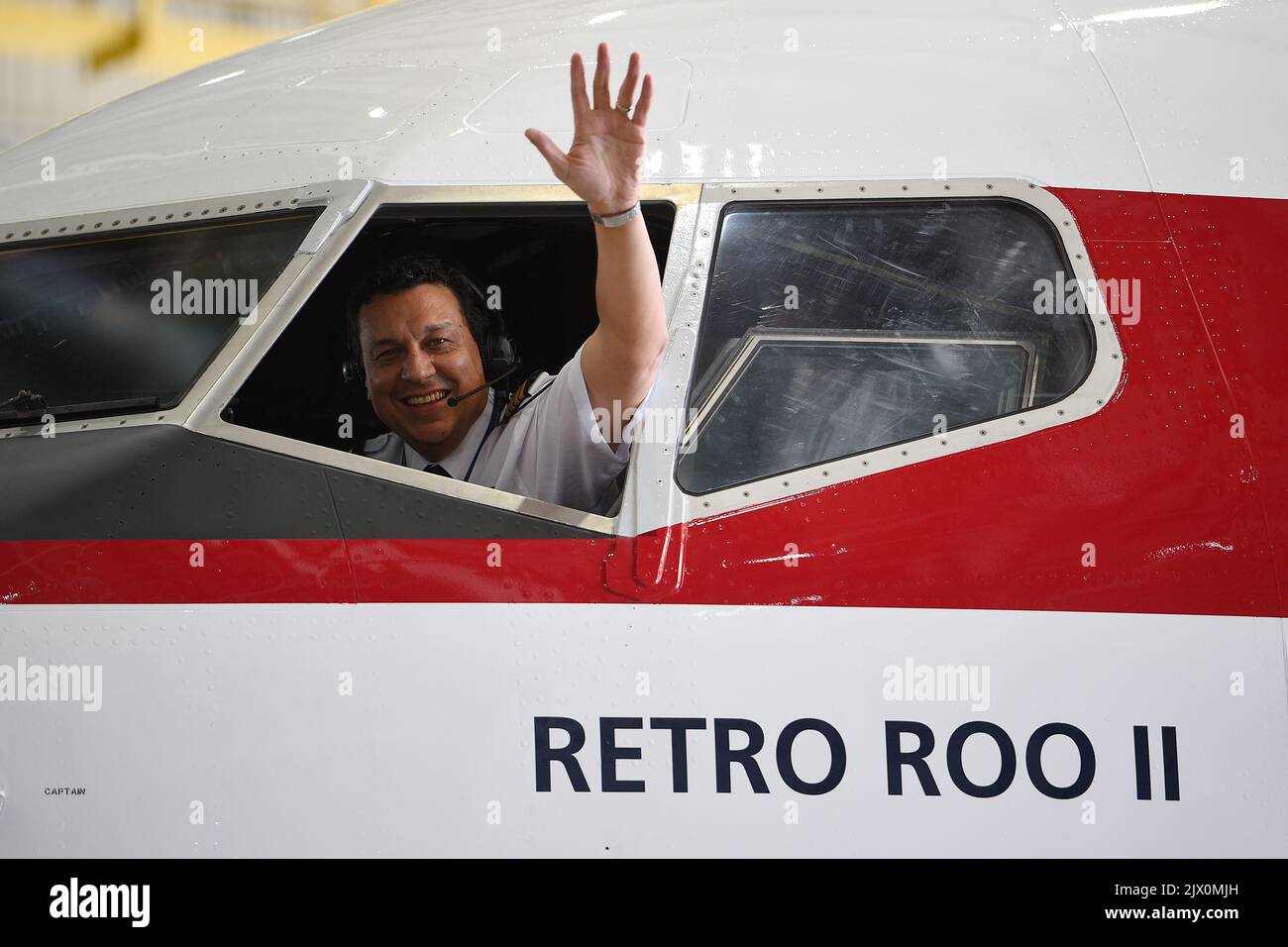 Captain Alex Passerine waves at the unveiling of the Qantas Retro Roo ...