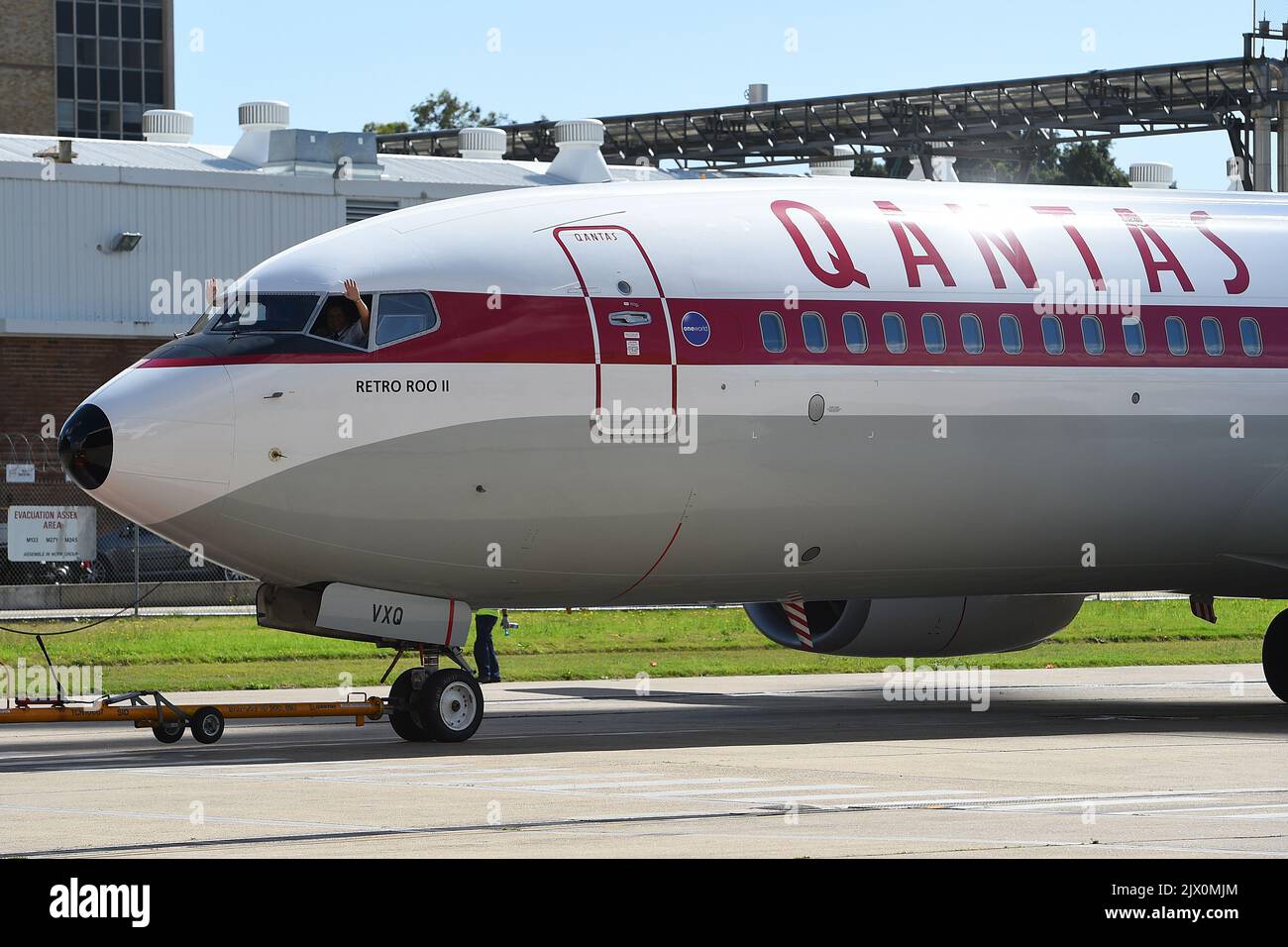 Captain Alex Passerine waves at the unveiling of the Qantas Retro Roo ...