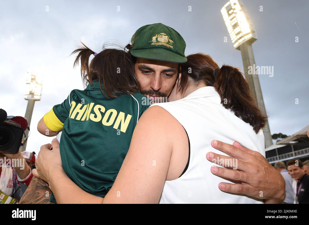 Australian cricketer Mitchell Johnson hugs his wife and daughter at ...