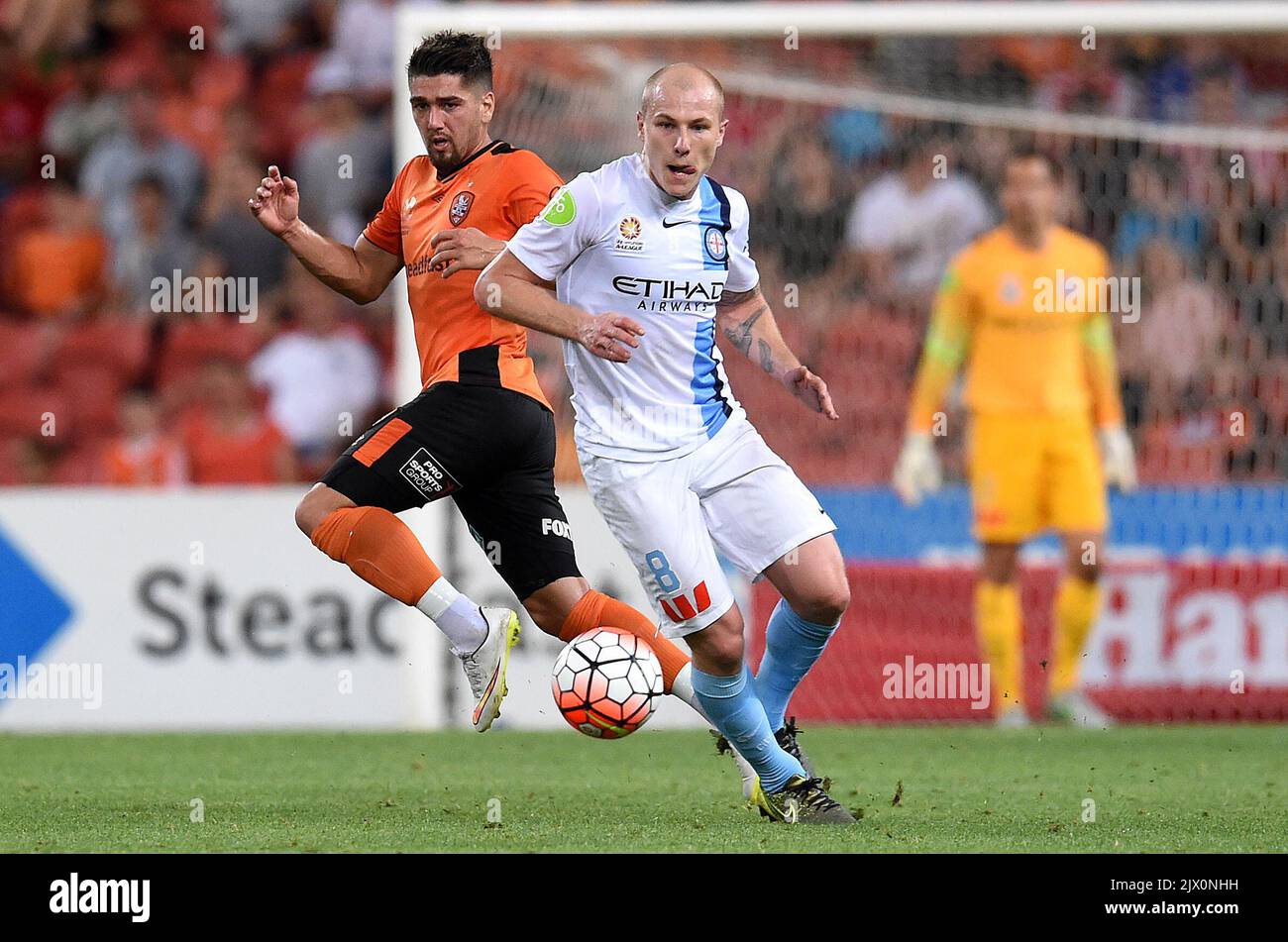 Dimitri Petratos of the Brisbane Roar (left) and Aaron Mooy of ...