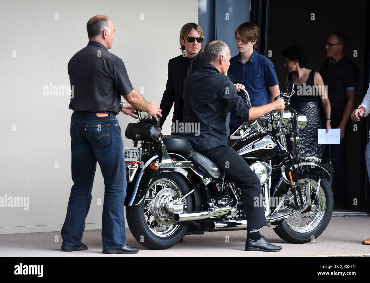 Australian country singer-songwriter Keith Urban (centre) and his ...
