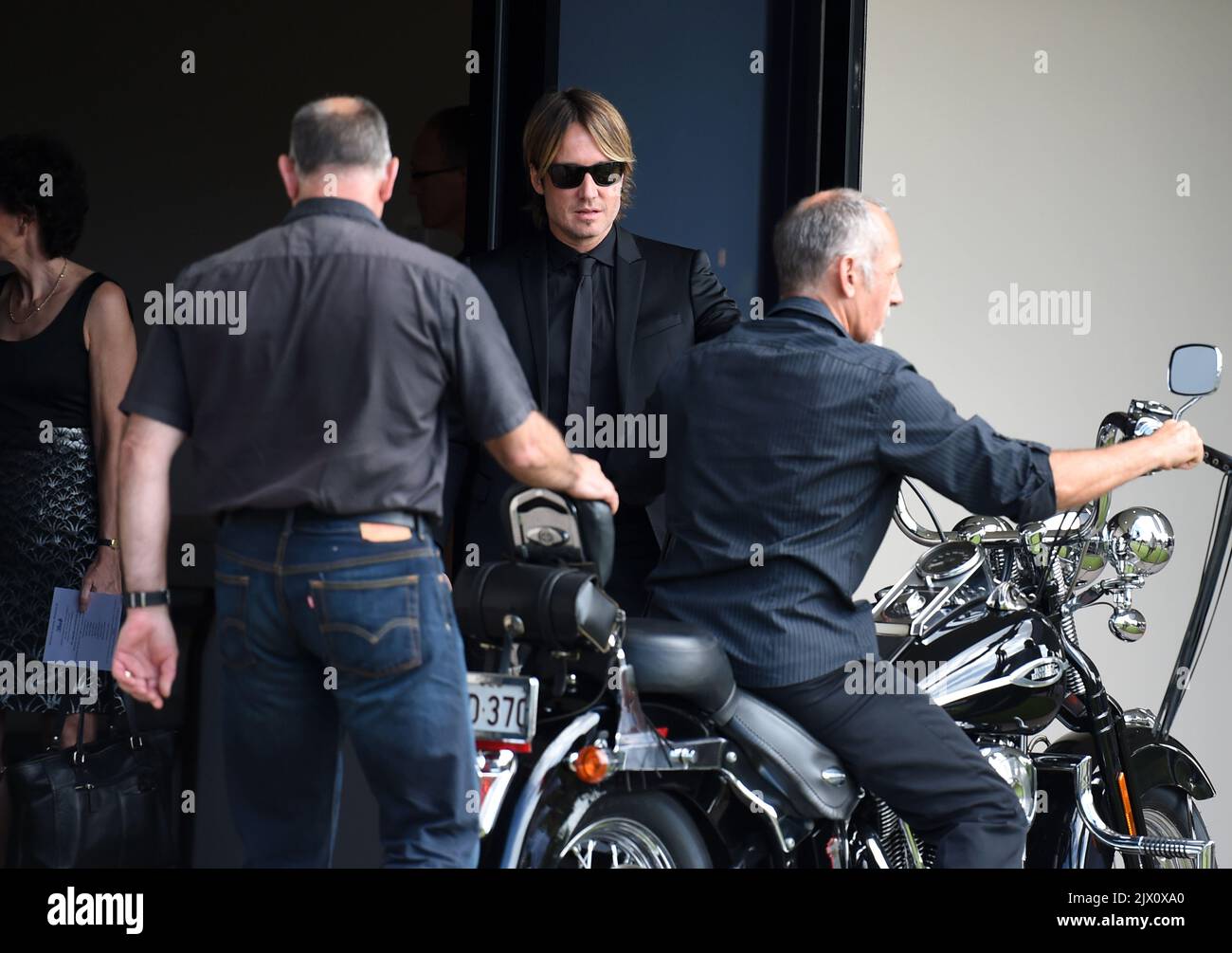 Australian country singer-songwriter Keith Urban (centre) and his ...
