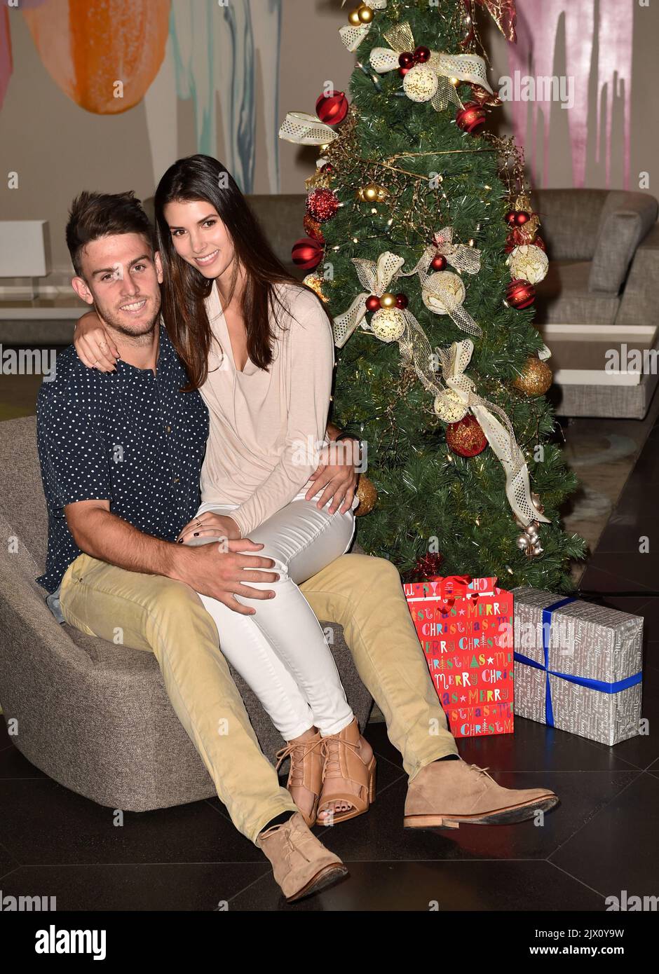 Australian cricketer Mitch Marsh (left) and Isabelle Platt pose for ...
