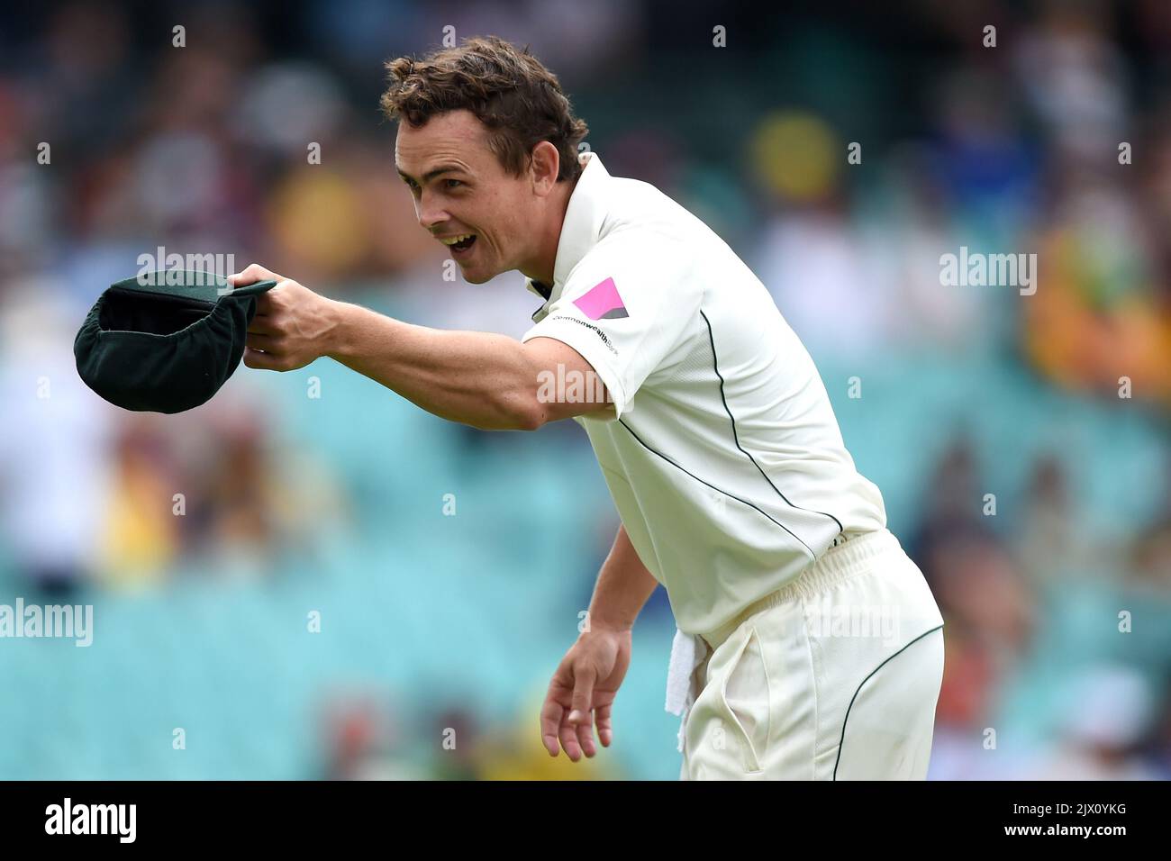 Australia's Stephen O'Keefe takes his hat off to the crowd on the first ...