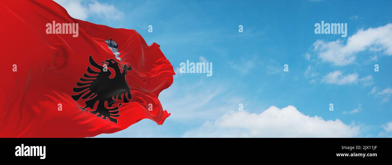flag of Albanian peoples Cham Albanians at cloudy sky background ...