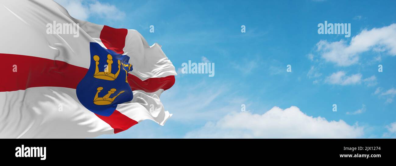 flag of Anglo-Frisian peoples East Anglians at cloudy sky background ...