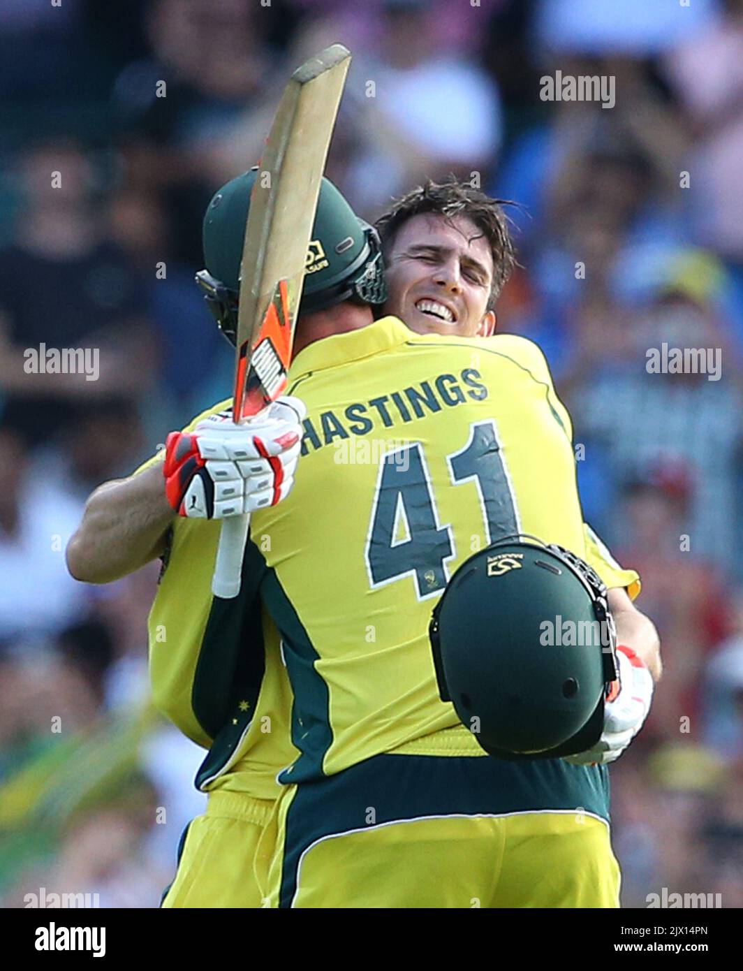 Australia's Mitchell Marsh celebrates with his team mate John Hastings ...