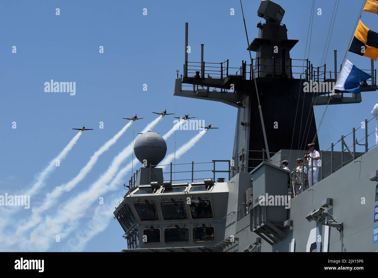 A fly past over HMAS Adelaide, Australia's newest Canberra Class ...