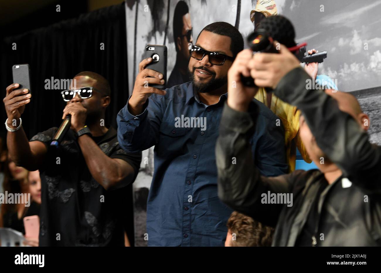 Comedian Kevin Hart (left) and rapper and actor Ice Cube take snap chat ...