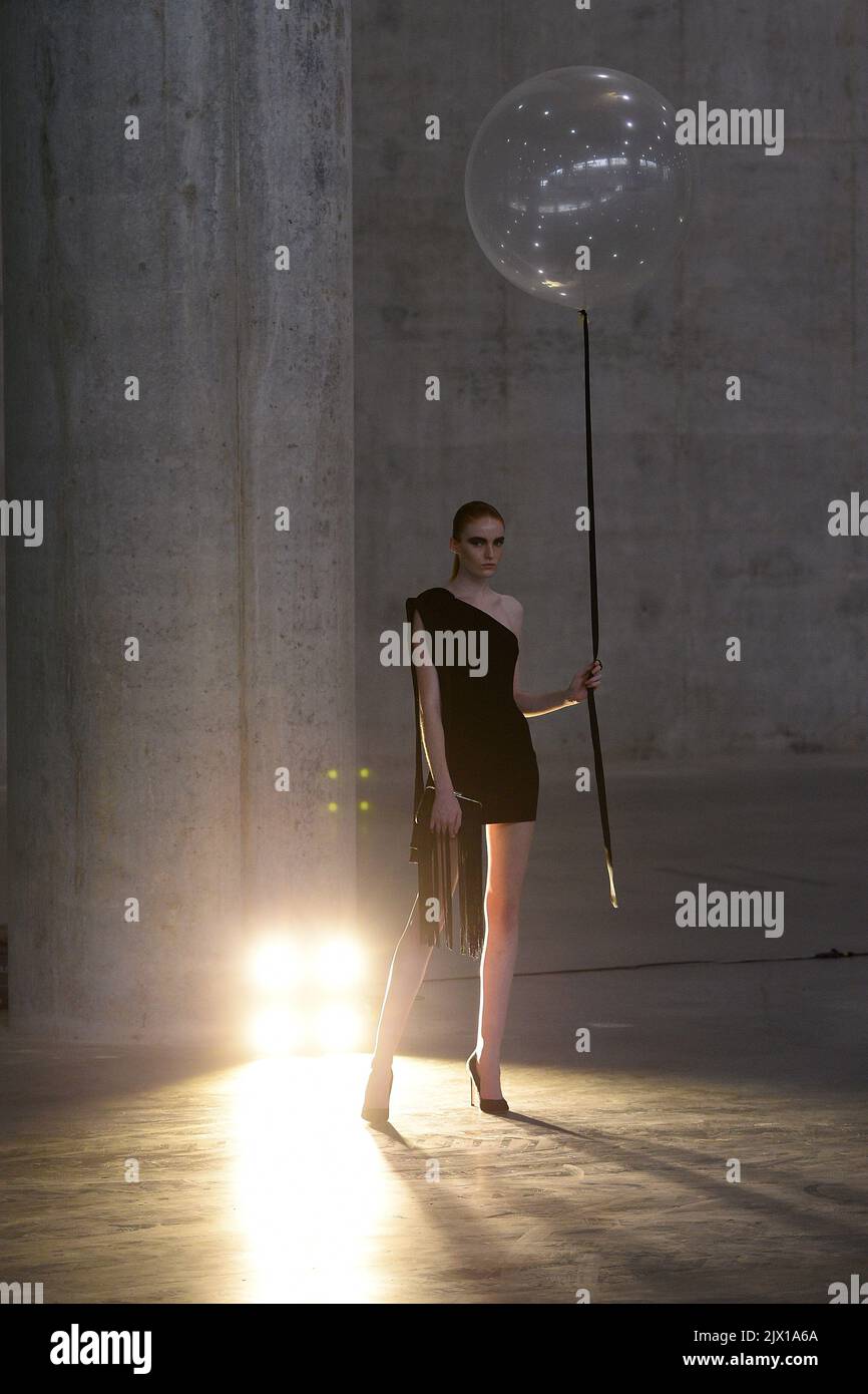 A model walks the runway wearing a design by Alex Perry during the Myer ...