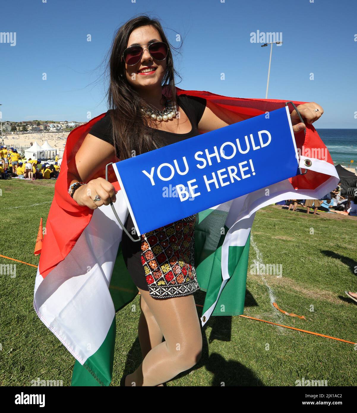A Italian student holds a sign while waiting for the world record ...