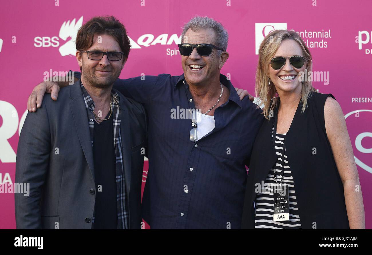 Actor Mel Gibson (centre) poses for photographers with John Polson ...