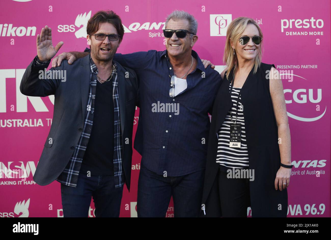 Actor Mel Gibson (centre) poses for photographers with John Polson ...