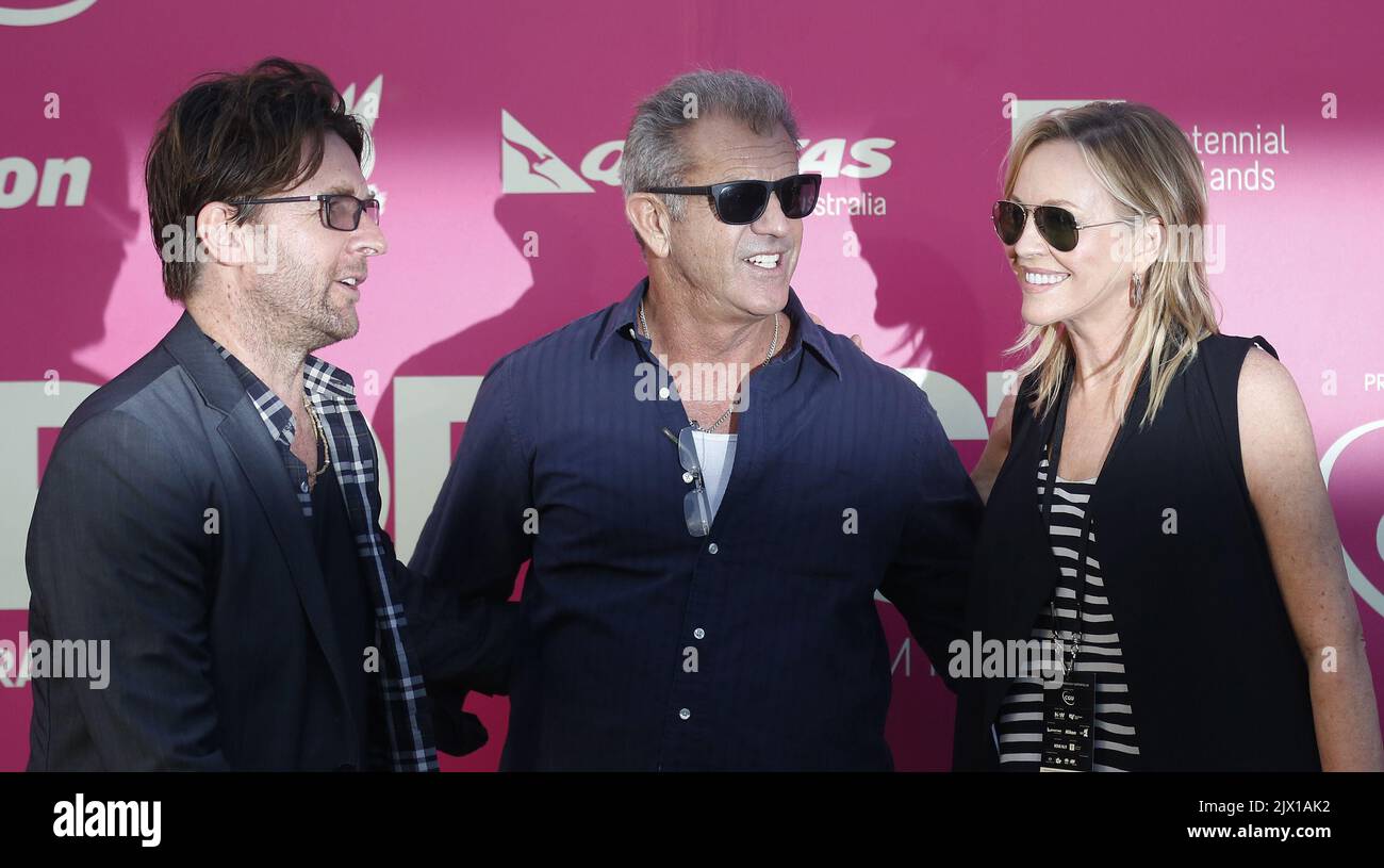 Actor Mel Gibson (centre) poses for photographers with John Polson ...