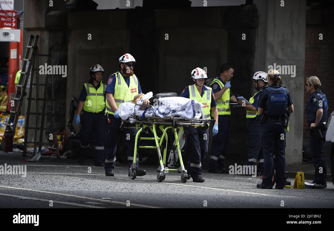 Emergency workers removing passengers at the scene of a bus accident on ...