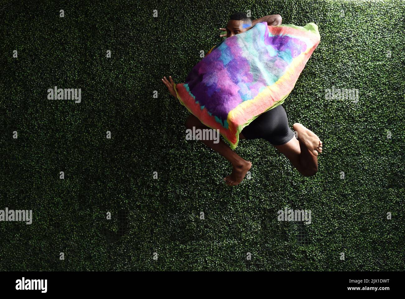 Indigenous models Hans David Ahwang from the Torres Strait wearing an ...