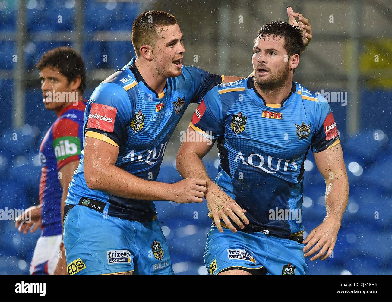 Titans player Nathan Davis congratulates Anthony Don (right) after he ...