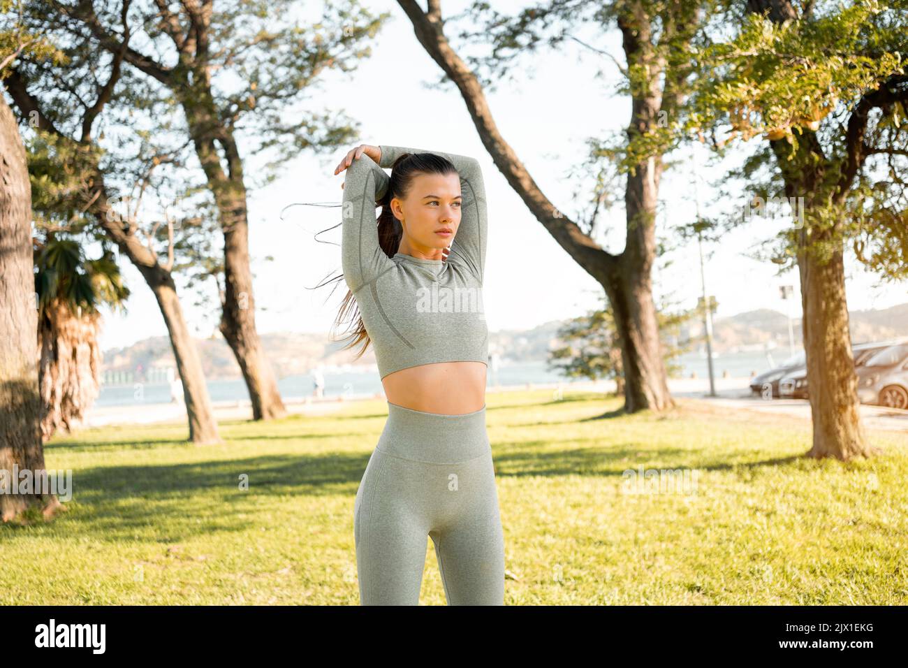 Woman Stretching And Warming-Up Before Running. Fit sport woman stretching her body warm up ...