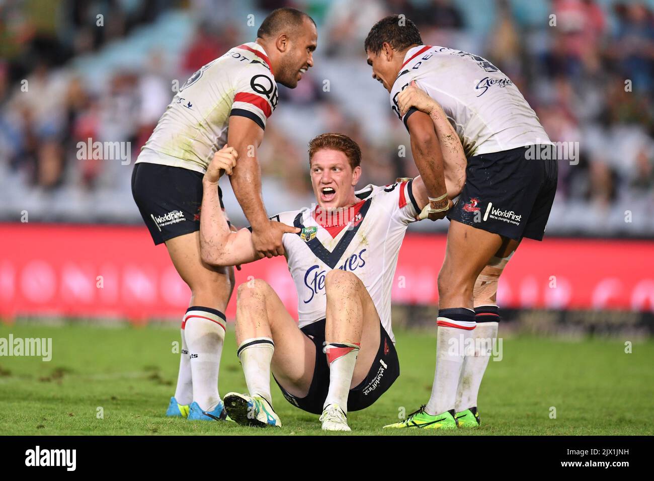 Dylan Napa of the Roosters celebrates with Sam Moa and Latrell Mitchell ...