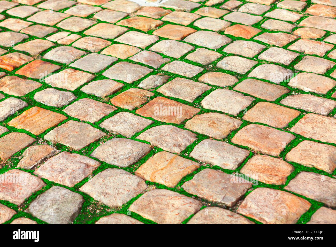 Cobble stones and moss . Brick background pavement Stock Photo - Alamy