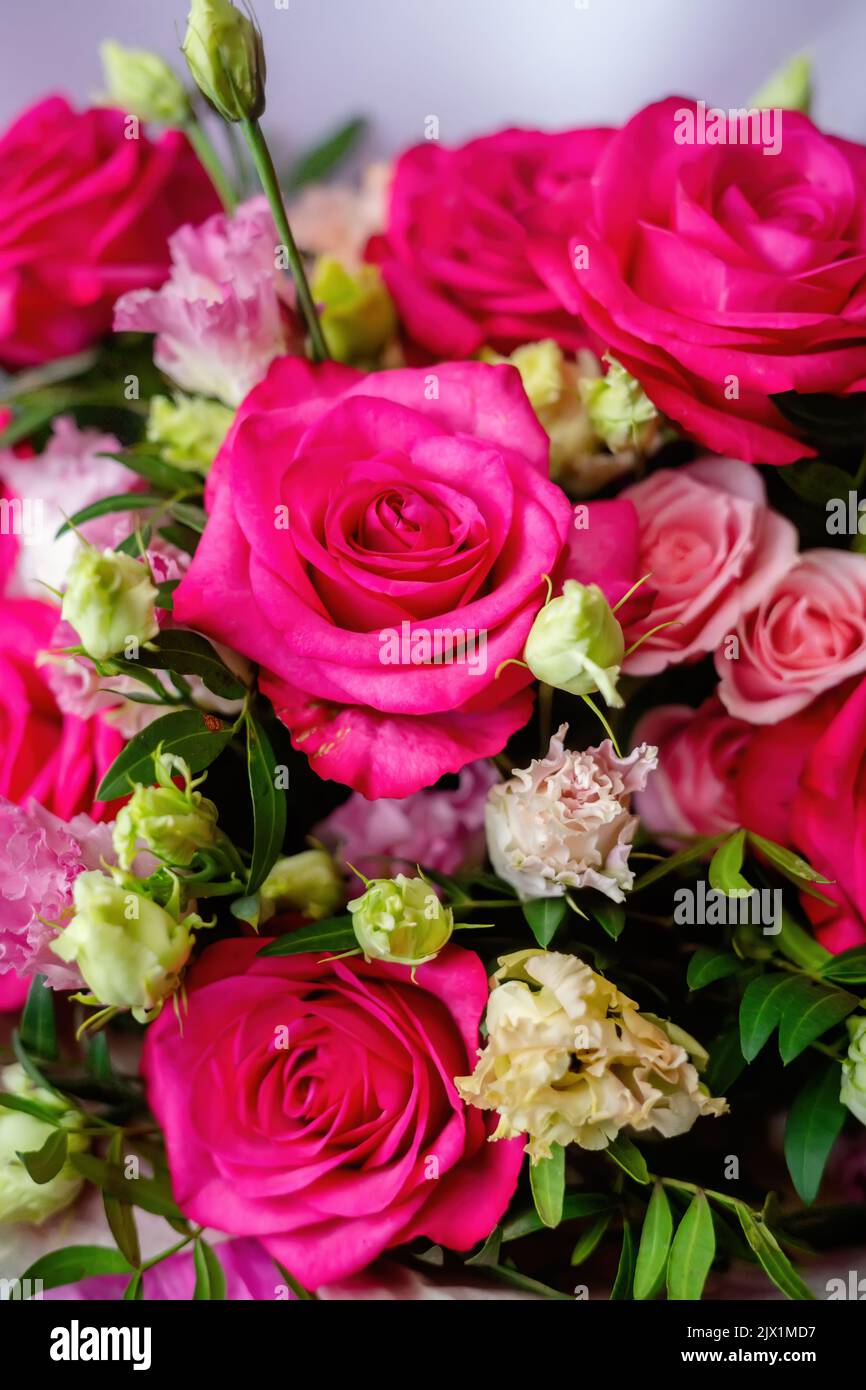 Natural background with raspberry rose and lisianthus Stock Photo - Alamy