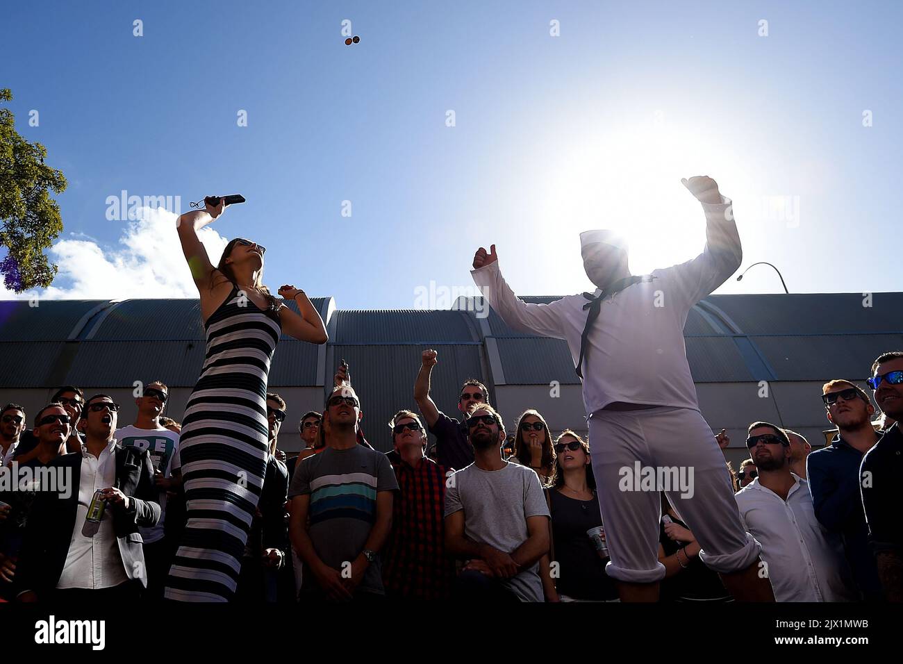 patrons take part in a traditional game of Two-Up on Anzac Day, at the ...