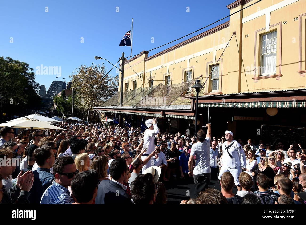patrons take part in a traditional game of Two-Up on Anzac Day, at the ...