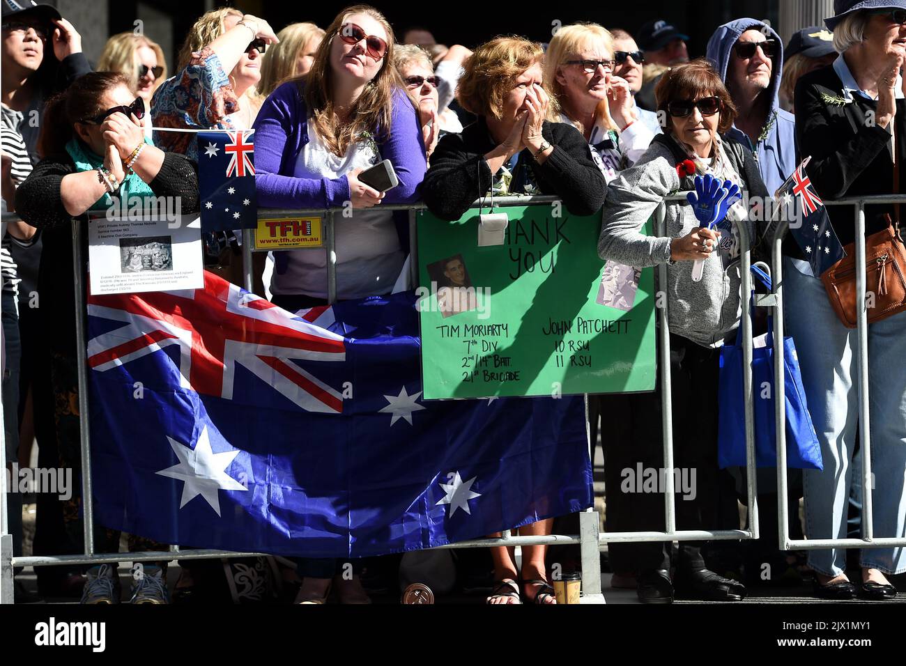 Spectators watch on during the Anzac Day march in Sydney, Monday, April ...